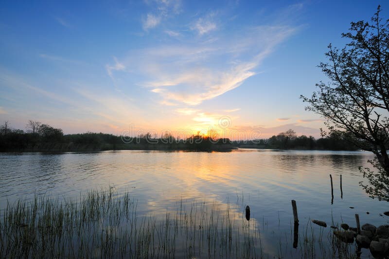 Sunset on the Shannon stock image. Image of rocks, tide - 5774983