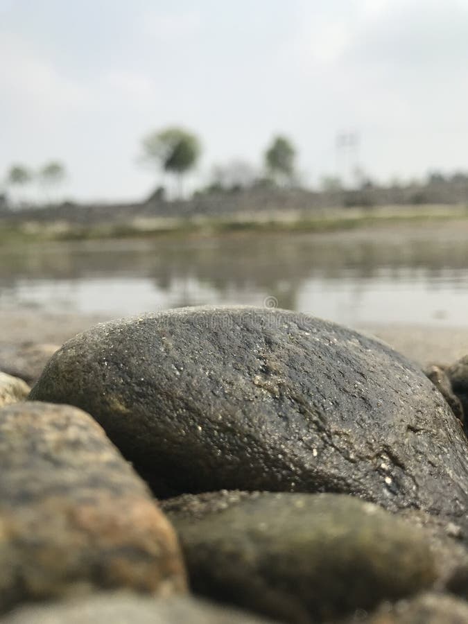 River Side Stone with Blur Effect in India Stock Photo - Image of wave ...