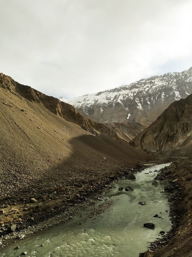 River in the Snow-capped Mountains Stock Photo - Image of scene, high ...