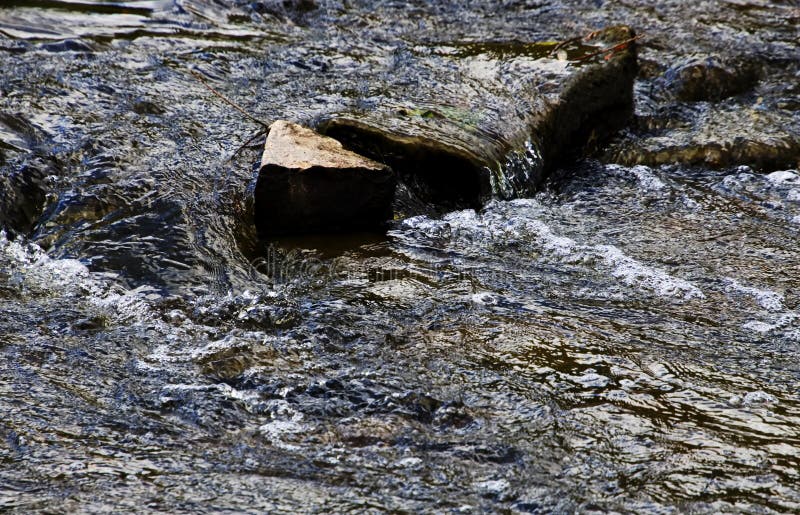 River Splashing and Swirling Over and Around Triangular Rocks Stock ...