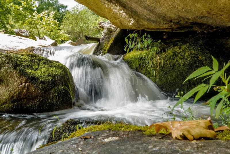 River Stream Flowing Over Rock Formations in the Mountains Stock Photo ...