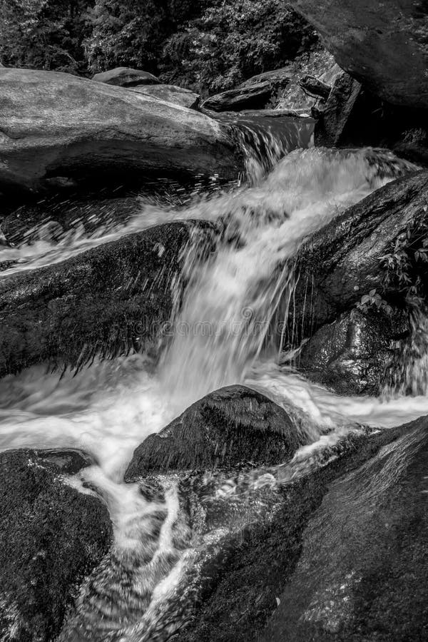 River Stream Flowing Over Rock Formations in the Mountains Stock Photo ...