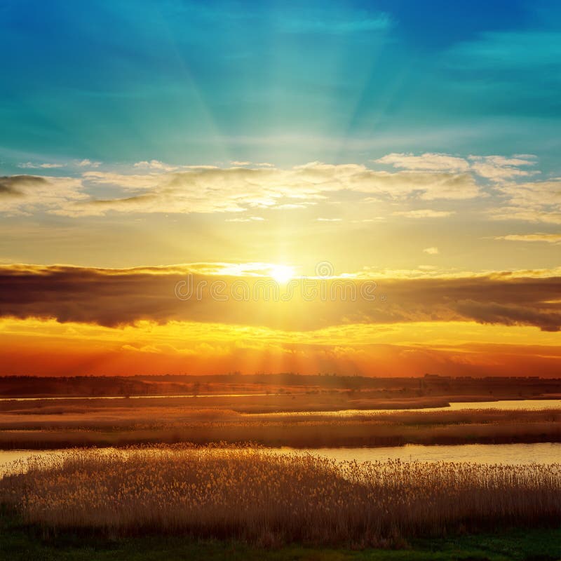 River and sunset in clouds stock image. Image of horizon - 59865437