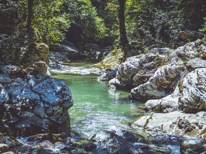 River Surrounded by Rocks stock image. Image of ravine - 119611243