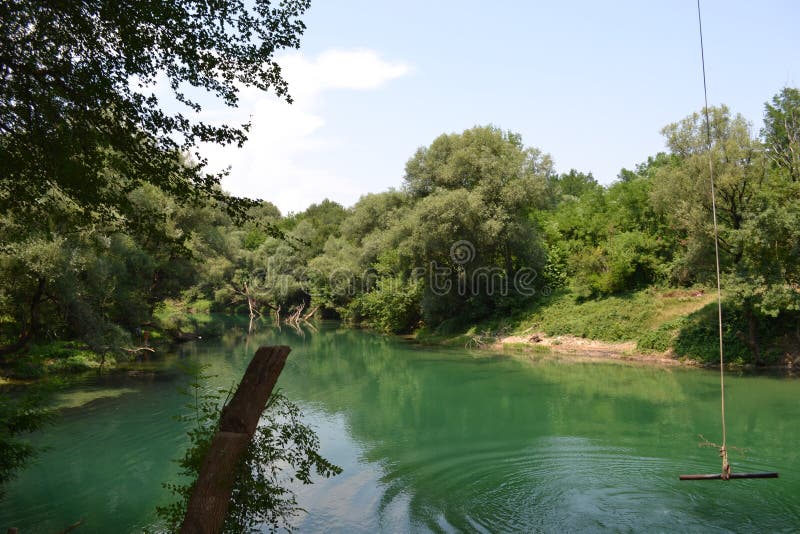 A River with Swing for Jumping Stock Image - Image of summer, leasure ...