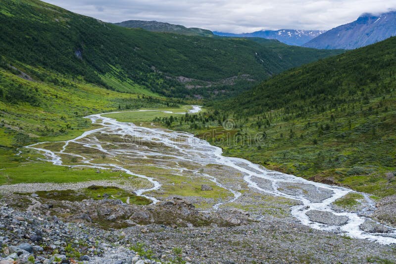 River System of Norwegian Glacier Steindalsbreen Meanders in a Green ...
