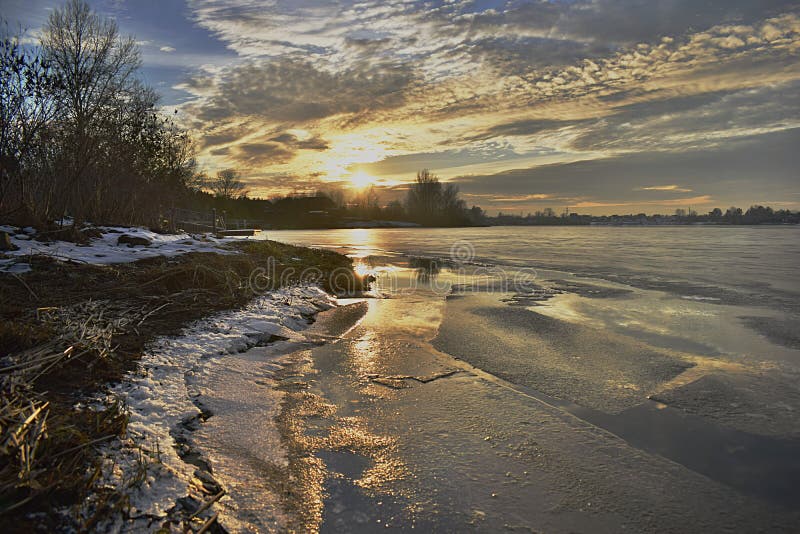 River with Thin Ice at the Setting Sun Stock Photo - Image of yellow ...