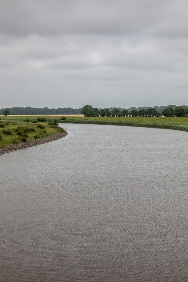 River Throught Green Fields of Grass in the Middle of the Countryside ...