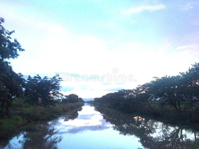 River tree sky stock image. Image of tree, dark, river - 99418983