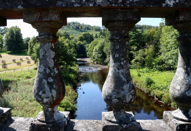 View of River through Old Stone Bridge Parapet Stock Image - Image of ...