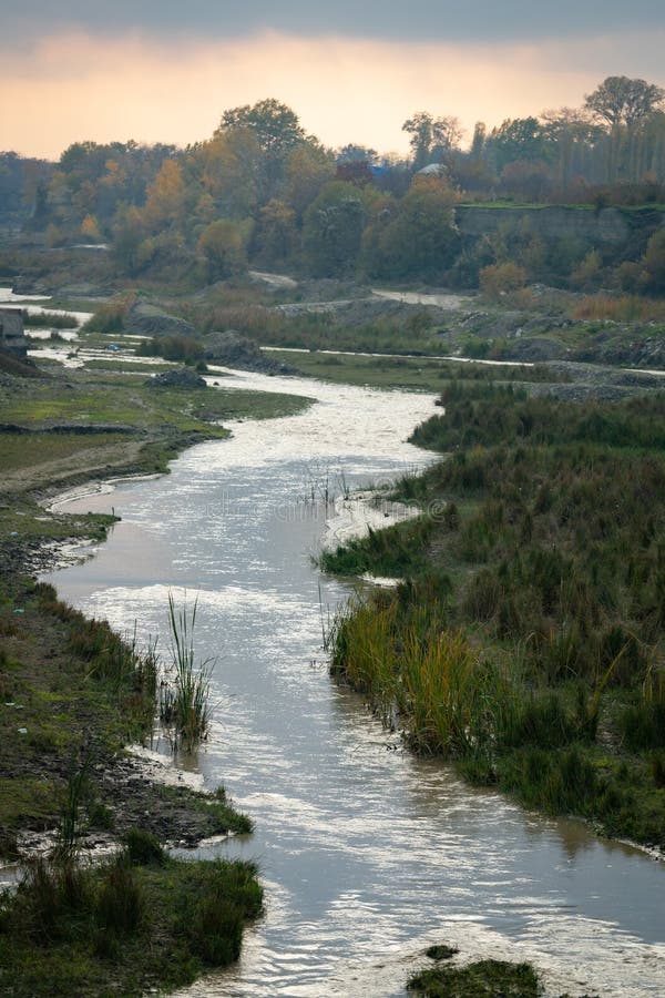 The River in the Village Flowing Along the Channel Stock Photo - Image ...