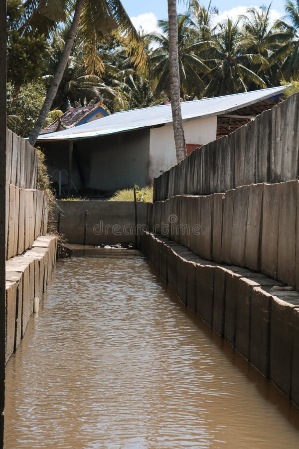 A River with a Wall on the Bank Stock Photo - Image of transport, fence ...