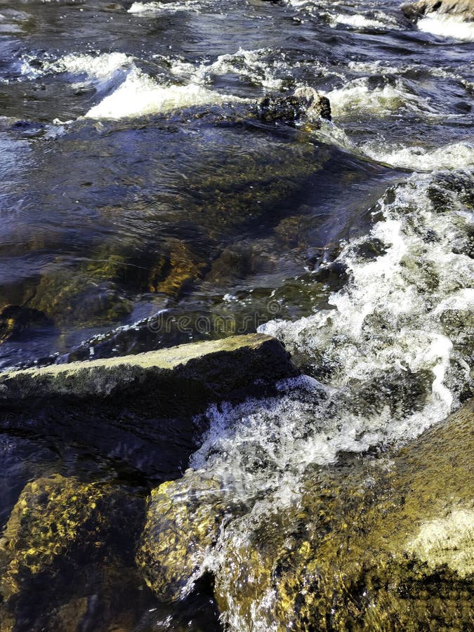 River Water Flowing and Bubbling Around Rocks Stock Image - Image of ...
