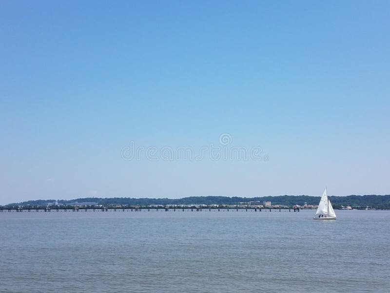 River Water with Sailboat and Pier and Washington, DC in the Background ...