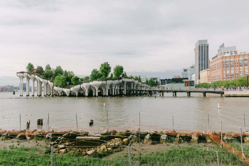 Riverfront Park Features Unique Structural Design with Greenery in ...