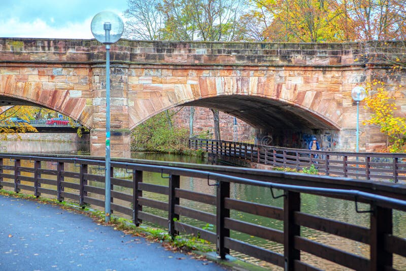 Riverside and Bridge with Arches Stock Photo - Image of building ...