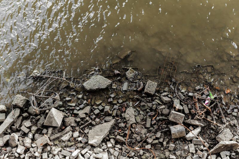 Riverside Debris and Garbage Stock Photo - Image of construction, crab ...