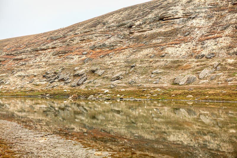 Riverside Rocky hill stock image. Image of reserve, clouds - 230563273