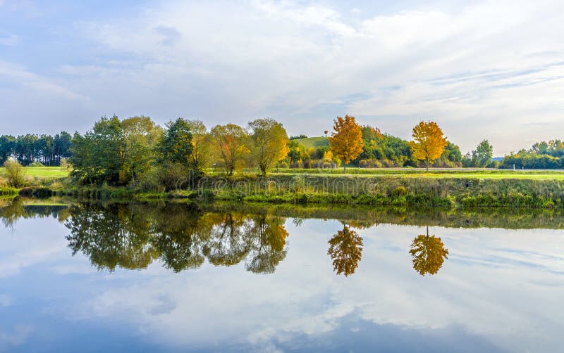 Riverside Scene with Trees that are Reflected in the River Tauber Stock ...