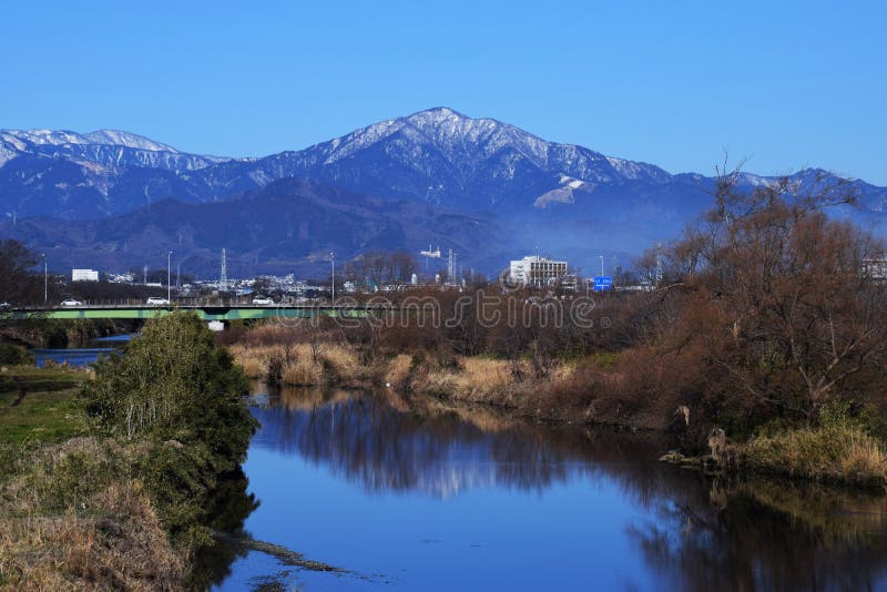 Riverside scenery of Japan stock photo. Image of mountains - 108915802