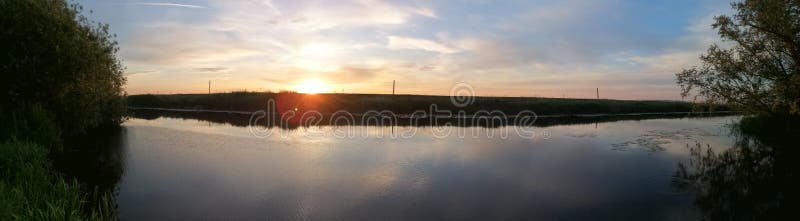 Riverside sunrise stock image. Image of clouds, sunrise - 149532421