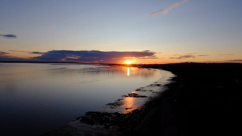 Riverside sunset stock image. Image of nightfall, riverside - 100058055