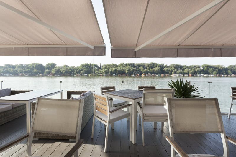 Riverside Terrace and Fireflies Stock Image - Image of stream, park ...