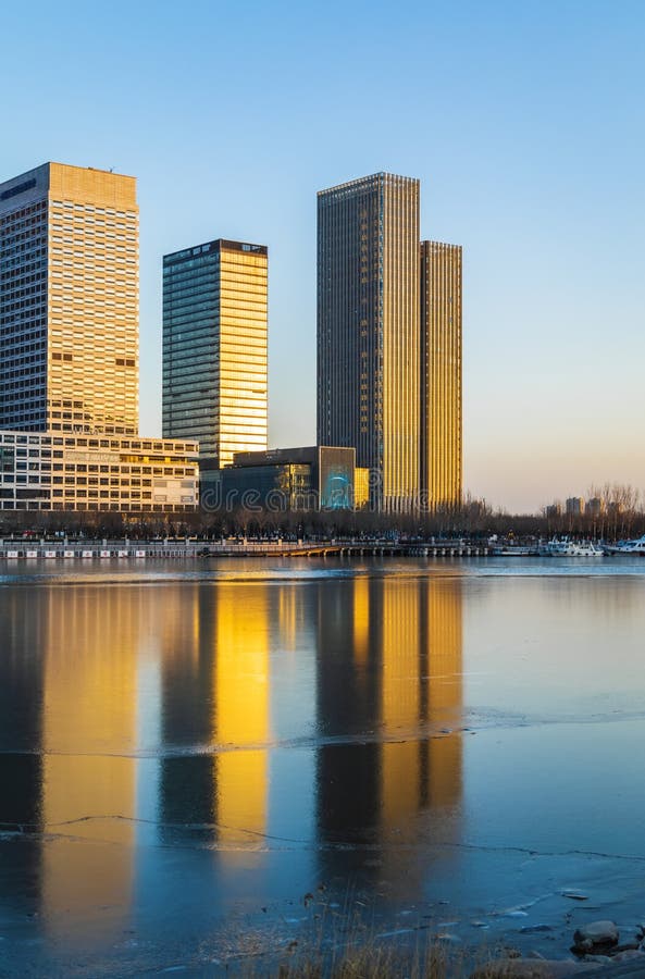 Riverside Towers in the Evening Stock Photo - Image of bridge ...