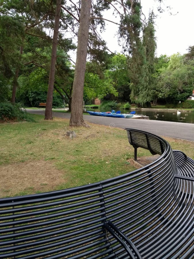 A riverside view with seat stock photo. Image of thames - 124621776