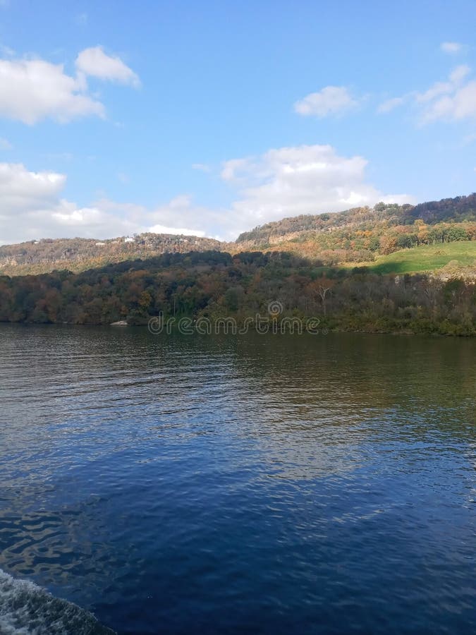 A Riverside View with White Clouds in a Blue Sky. Stock Image - Image ...