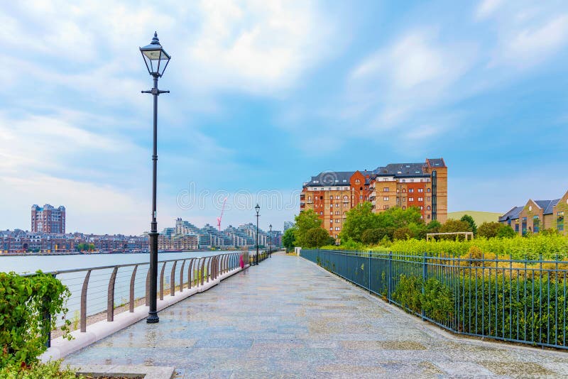 Riverside walking path stock image. Image of modern, evening - 76659119