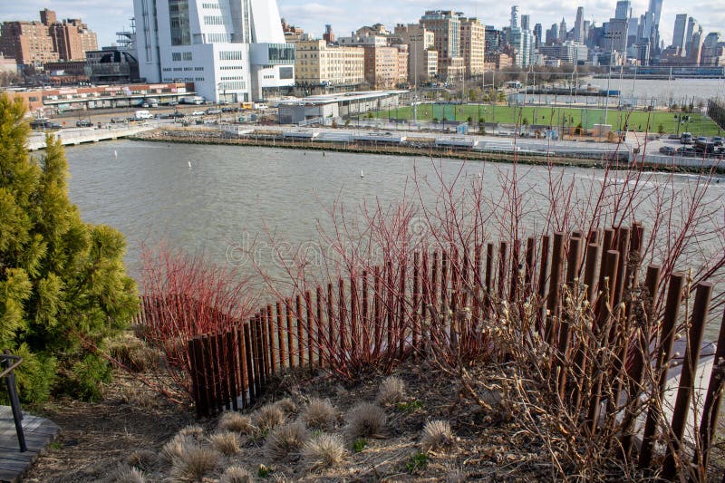 Riverside Wooden Fence with Distant Buildings in Background Stock Photo ...