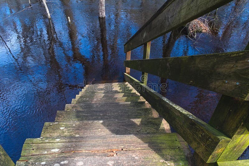 Riverwalk Stems Descend into the Water Stock Photo - Image of outside ...