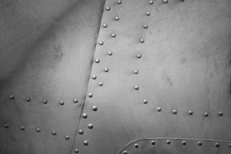 Riveted metal wall surface stock image. Image of orange - 127766633