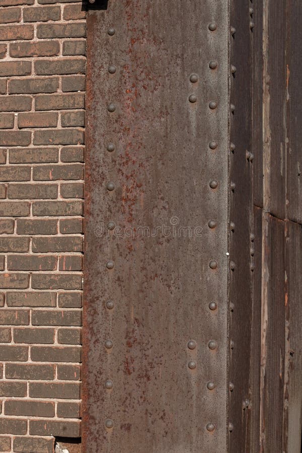 Riveted Steel Corner with Heavy Rust Patina, Brown Brick, Copy Space ...