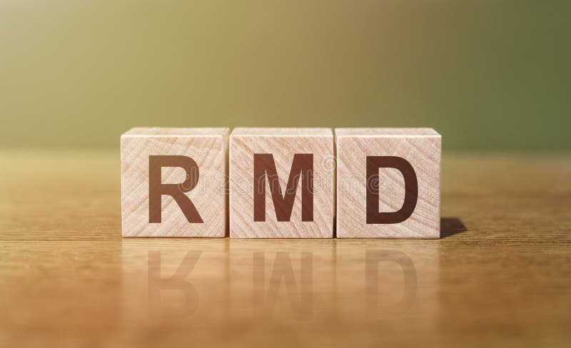 RMD - Required Minimum Distributions. Word Written on Wooden Blocks on ...