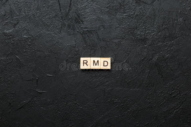RMD Word Written on Wood Block. Required Minimum Distributions Text on ...