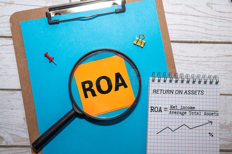 ROA - Short for Return on Assets. Text on Wood Cubes with Euro Bills ...