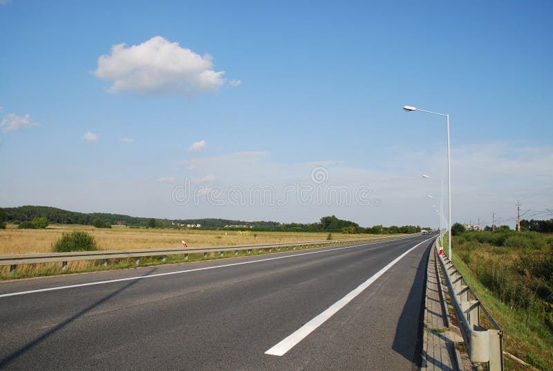 Converging Lines of Road on Bridge Stock Photo - Image of blue, travel ...