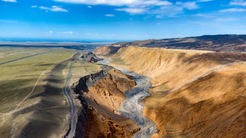 Road Along the River Going through Mountains and Cliffs, Aerial Stock ...