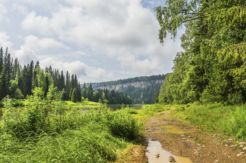 The road along the river stock photo. Image of building - 90653916