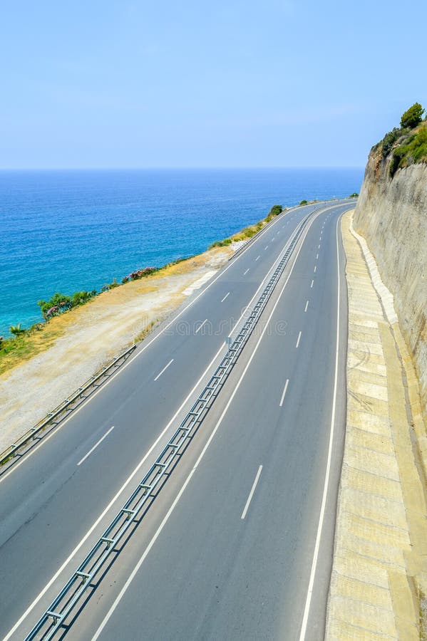 The Road Along the Seashore. Stock Photo - Image of clouds, beach: 81823636