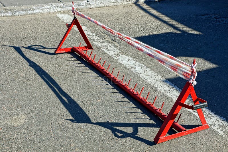 Spikes In A Parking Lot Enforcing Wrong Way. Stock Photo - Image of ...