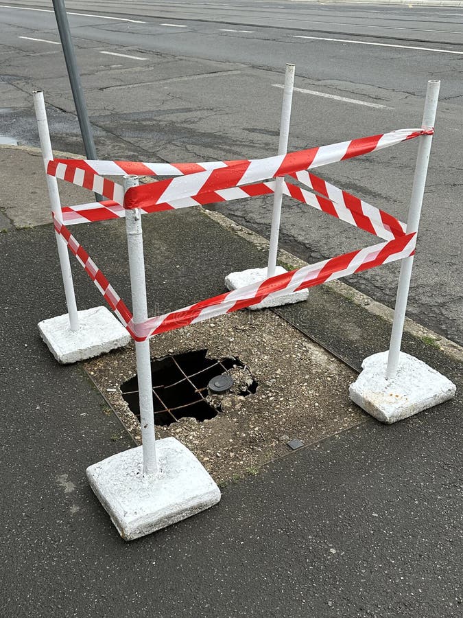 Road Barrier Over a Broken Man Hole Stock Image - Image of road ...