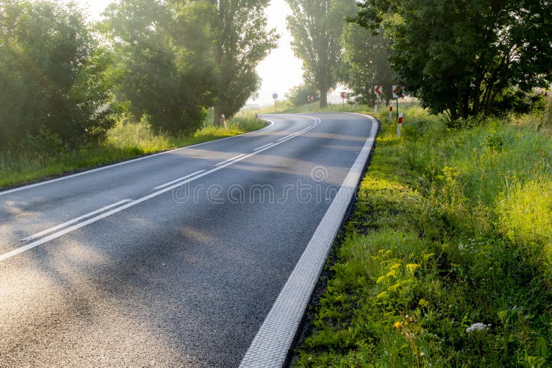 Road bend in the morning stock image. Image of countryside - 252707373