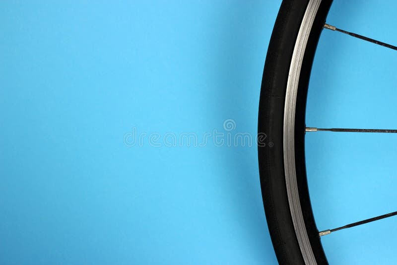 Road Bike Wheel on a Blue Background. Copyspace for Your Text Stock ...