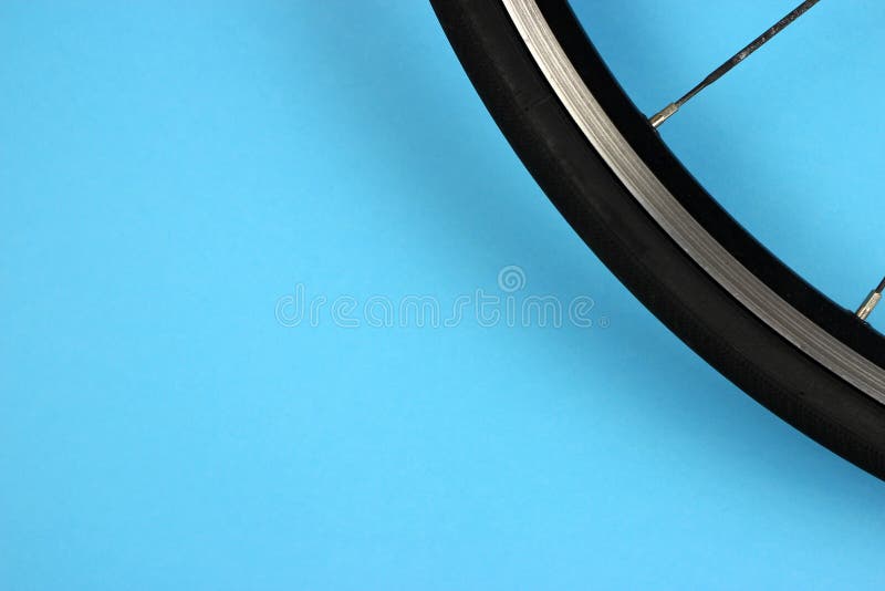 Road Bike Wheel on a Blue Background. Copyspace for Your Text Stock ...