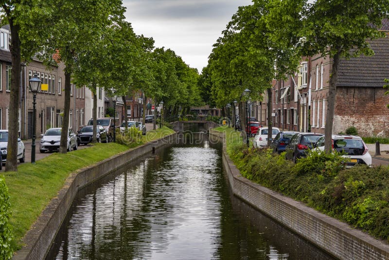 Road and Brick Houses by a Canal in the Netherlands. Summer Stock Image ...