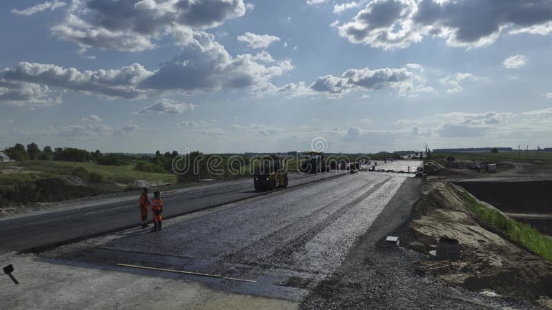 Builders Lay New Asphalt Pavement Using Road Rollers Stock Footage ...