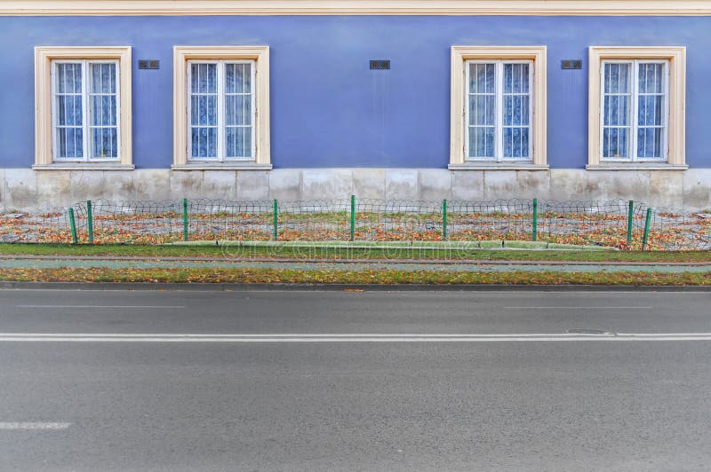 Road in the City with Blue Building Stock Photo - Image of landscape ...